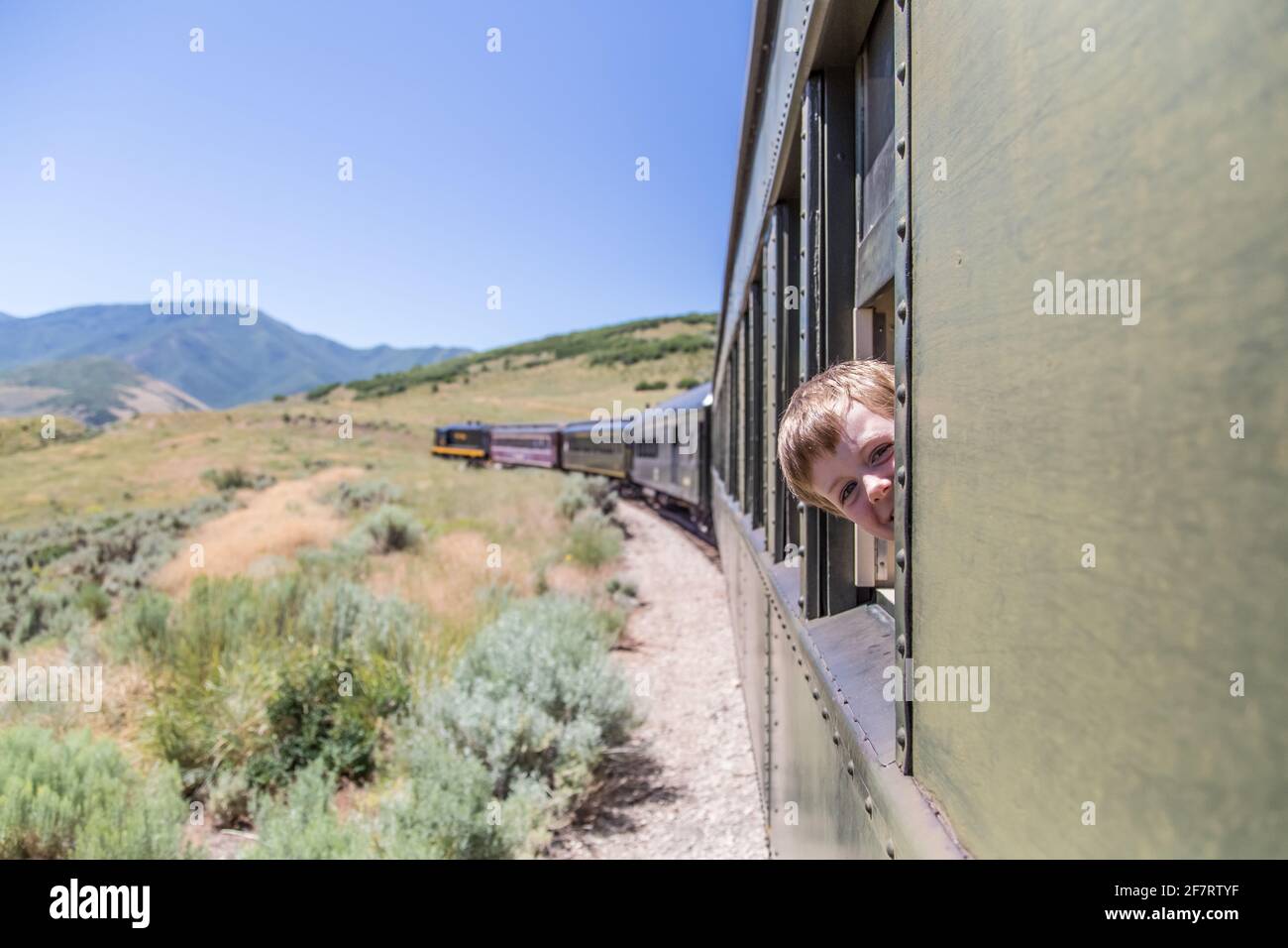 Boy looking out train window hi-res stock photography and images - Alamy