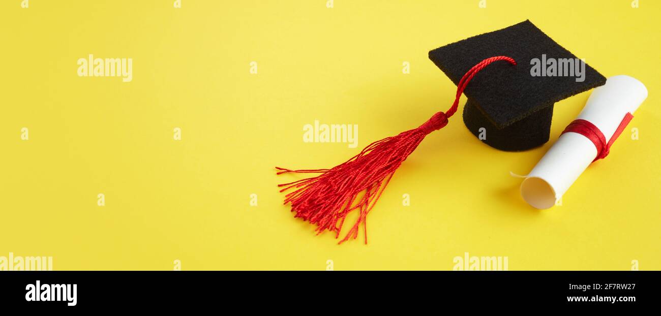 Academic hat with diploma on yellow background. Graduation theme Stock ...