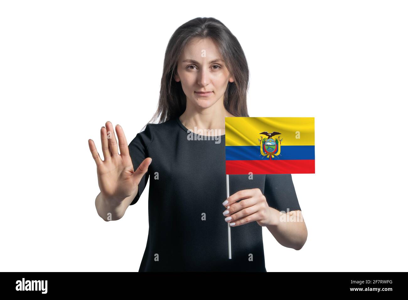 Happy young white woman holding flag of Ecuador and with a serious face ...
