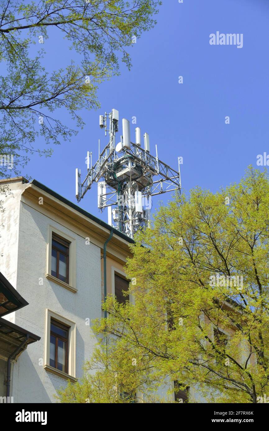 New 5G communication tower on residential building in urban scenery ...