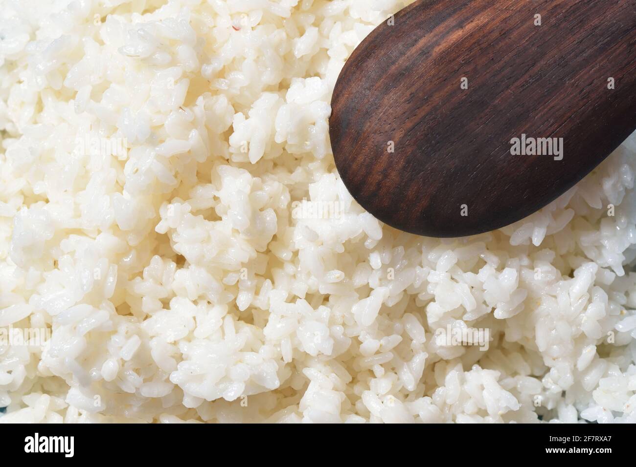 Fresh boiled rice and wooden spoon Stock Photo - Alamy