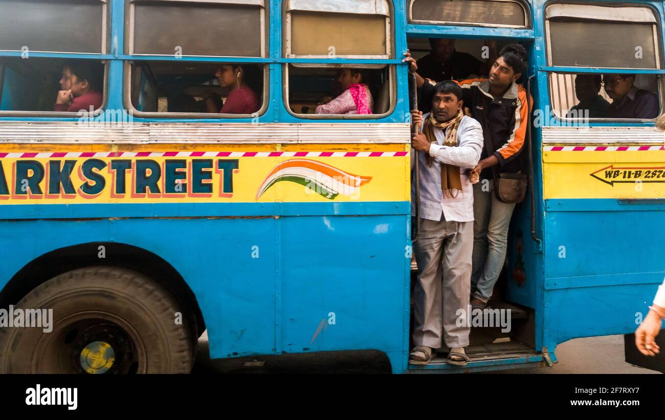 Man hanging off bus hi-res stock photography and images - Alamy