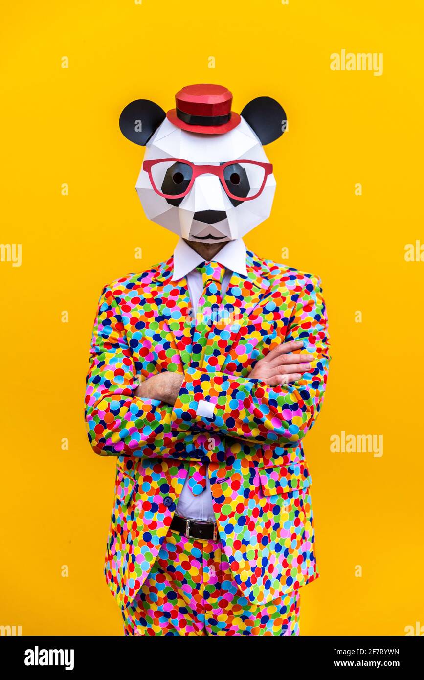 Happy man with funny low poly mask on colored background - Creative ...