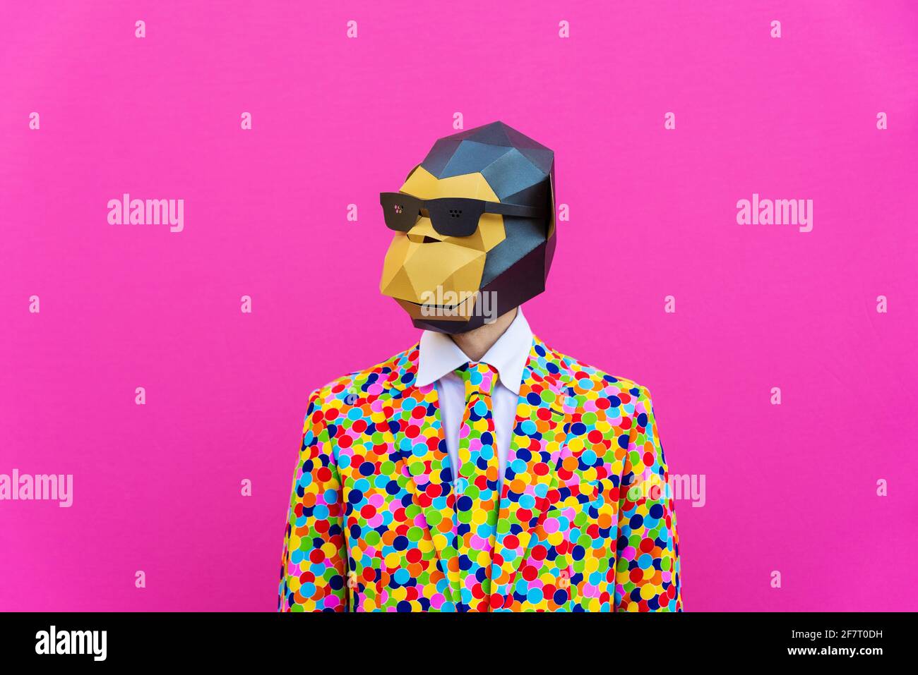 Happy man with funny low poly mask on colored background - Creative ...