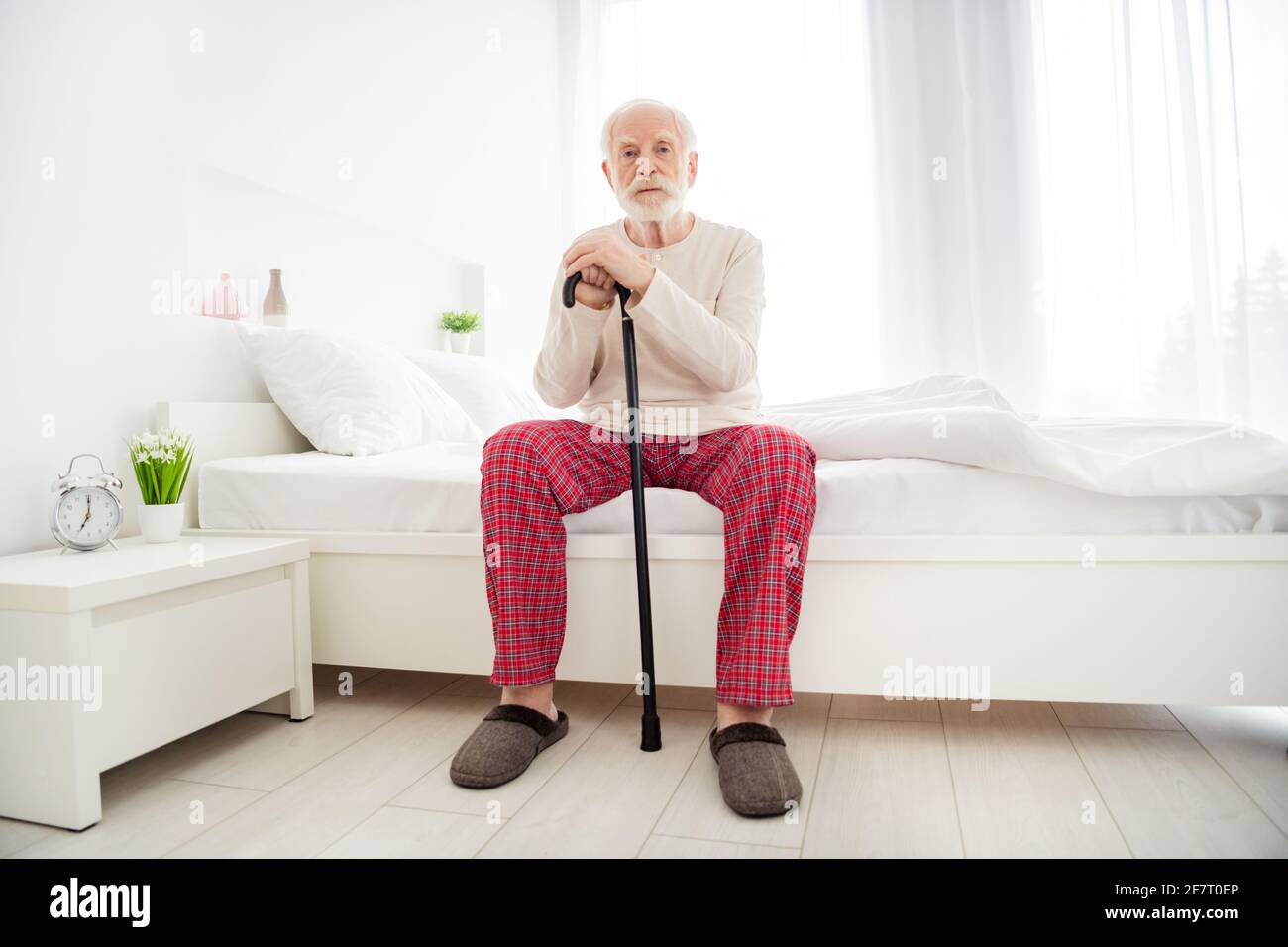 Full body photo of aged man pensioner unhappy sad upset alone think sit ...