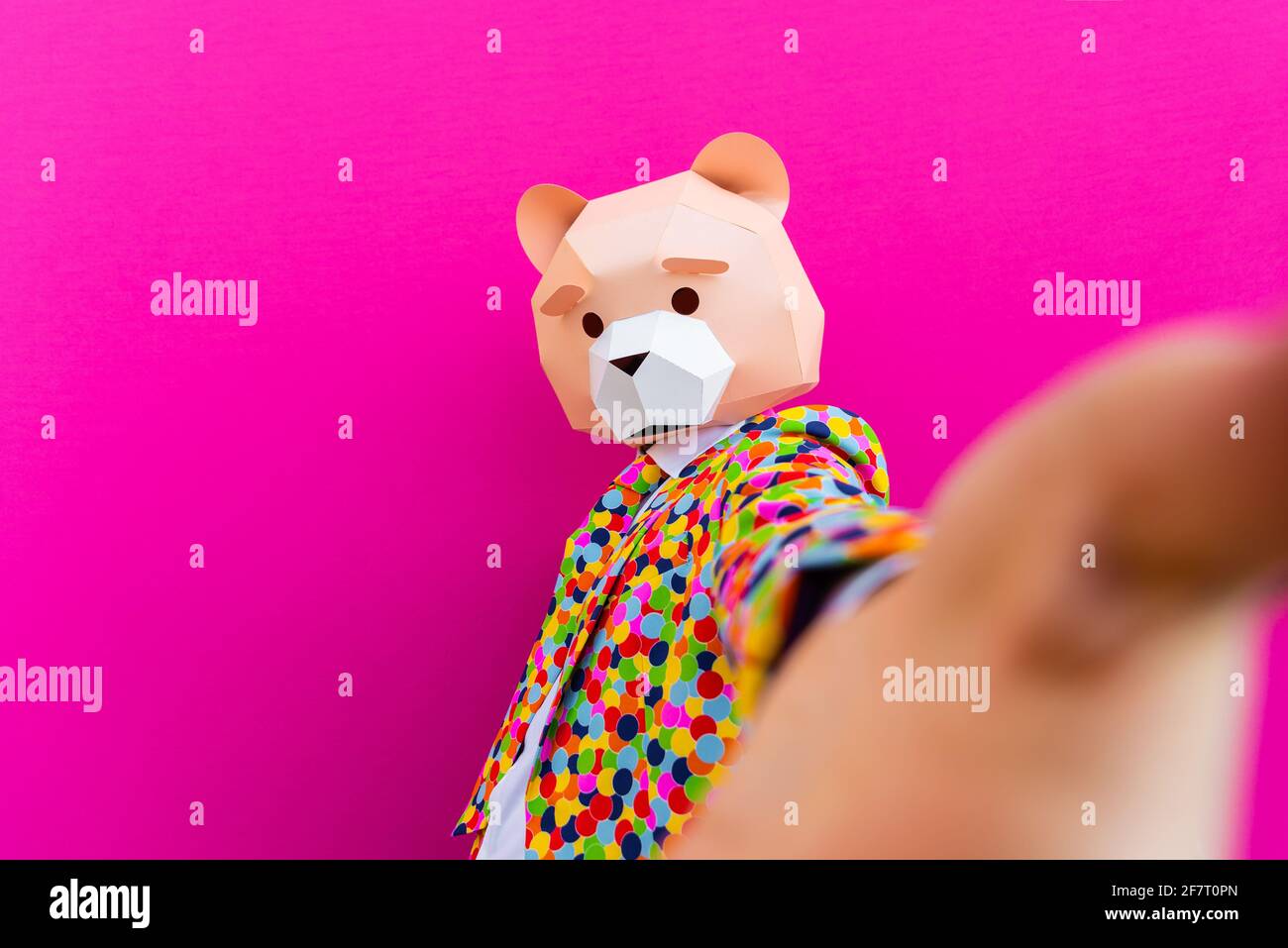 Happy man with funny low poly mask on colored background - Creative ...