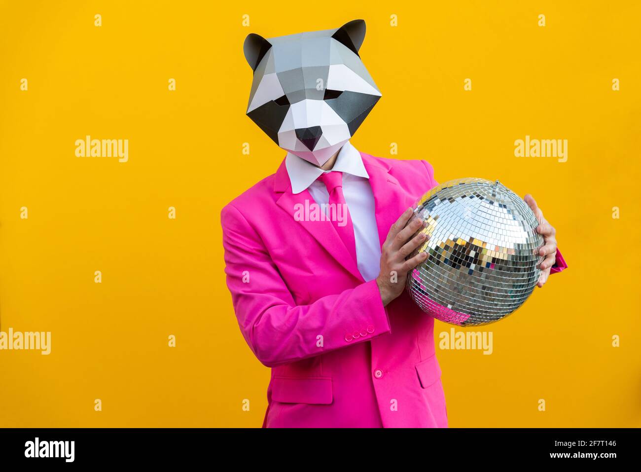 Happy man with funny low poly mask on colored background - Creative ...