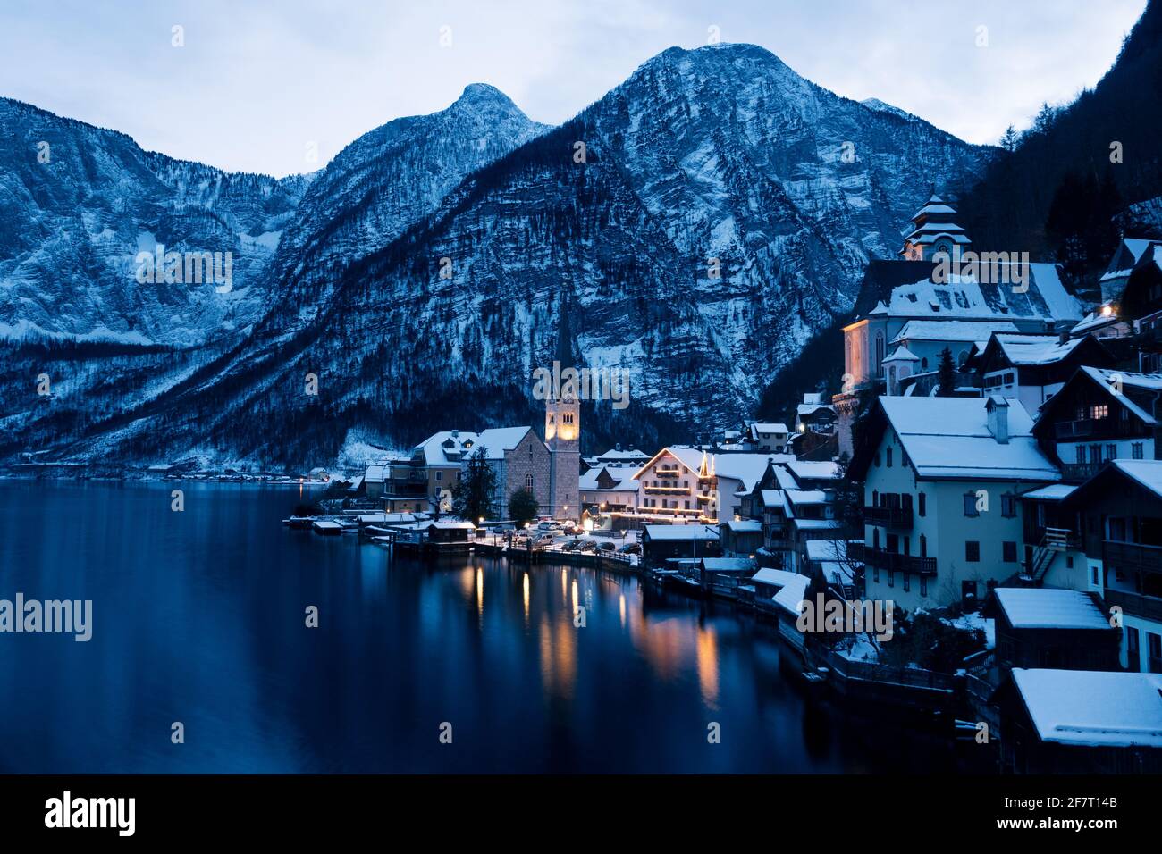 Hallstatt Cityscape on a Cold Winter Evening Covered with Snow with the ...