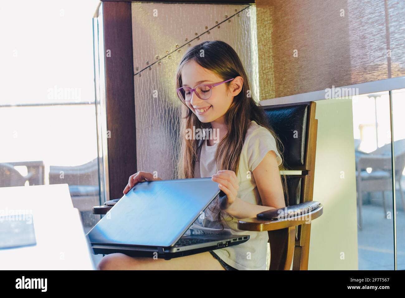Teenage girl at the computer home teaching. computer, distant learn ...