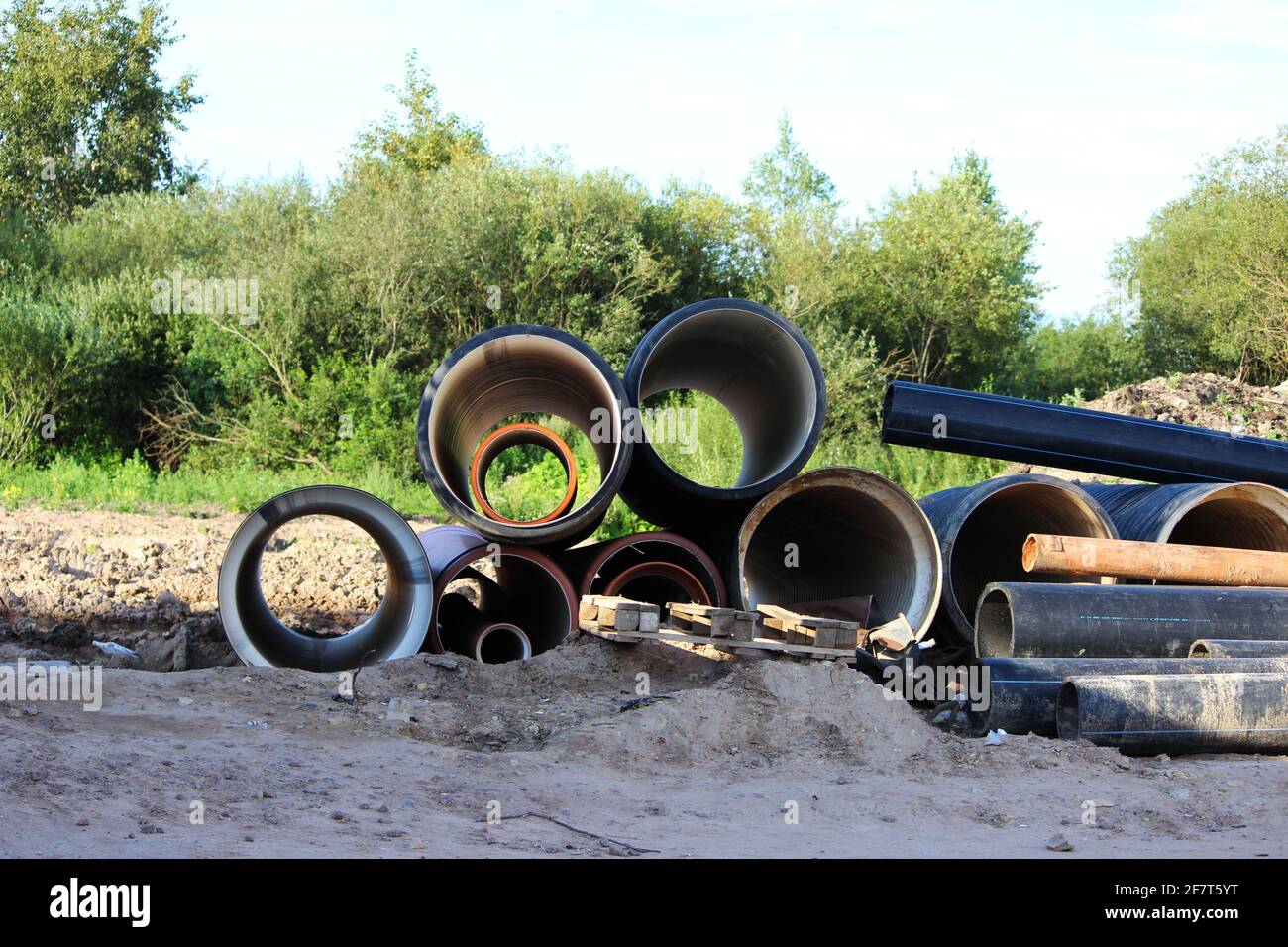 concrete rainwater rings and pipes covered with black tar bitumen ...