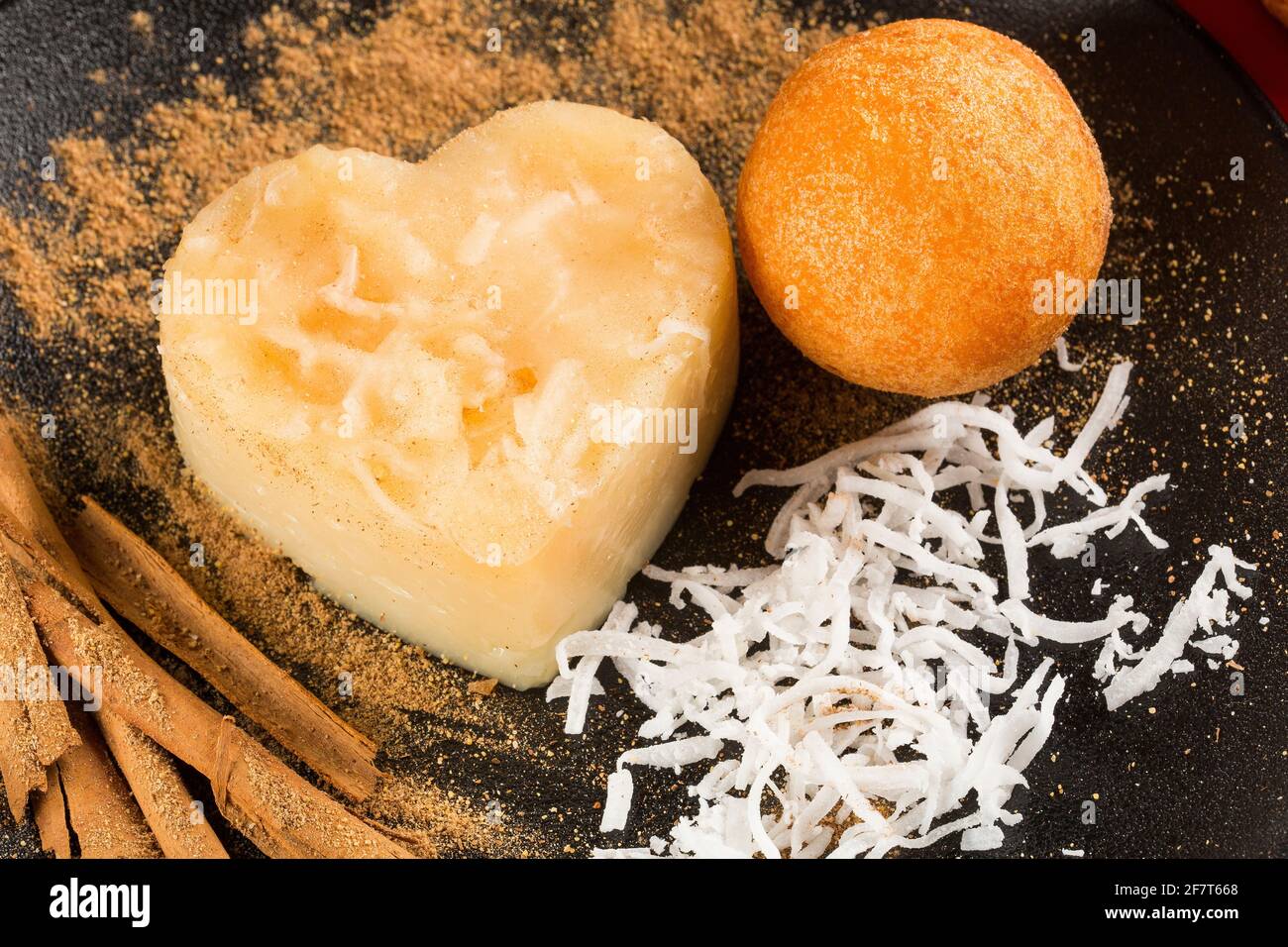 Traditional Colombian bunuelos (Deep Fried Cheese Bread) and natilla on ...