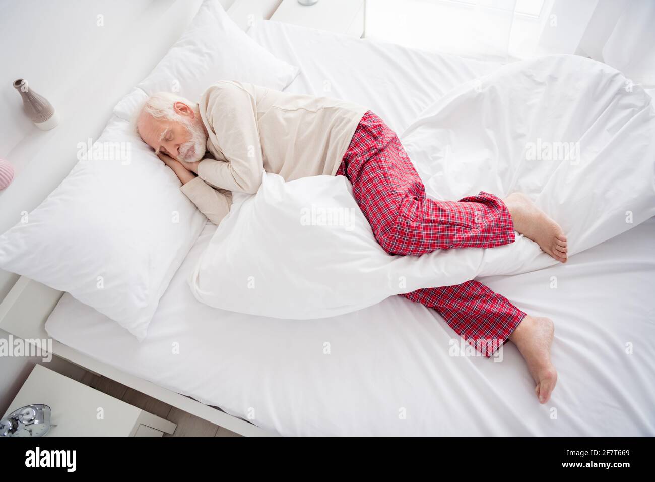 Top above high angle view of aged man lying in bed sleeping in silence ...