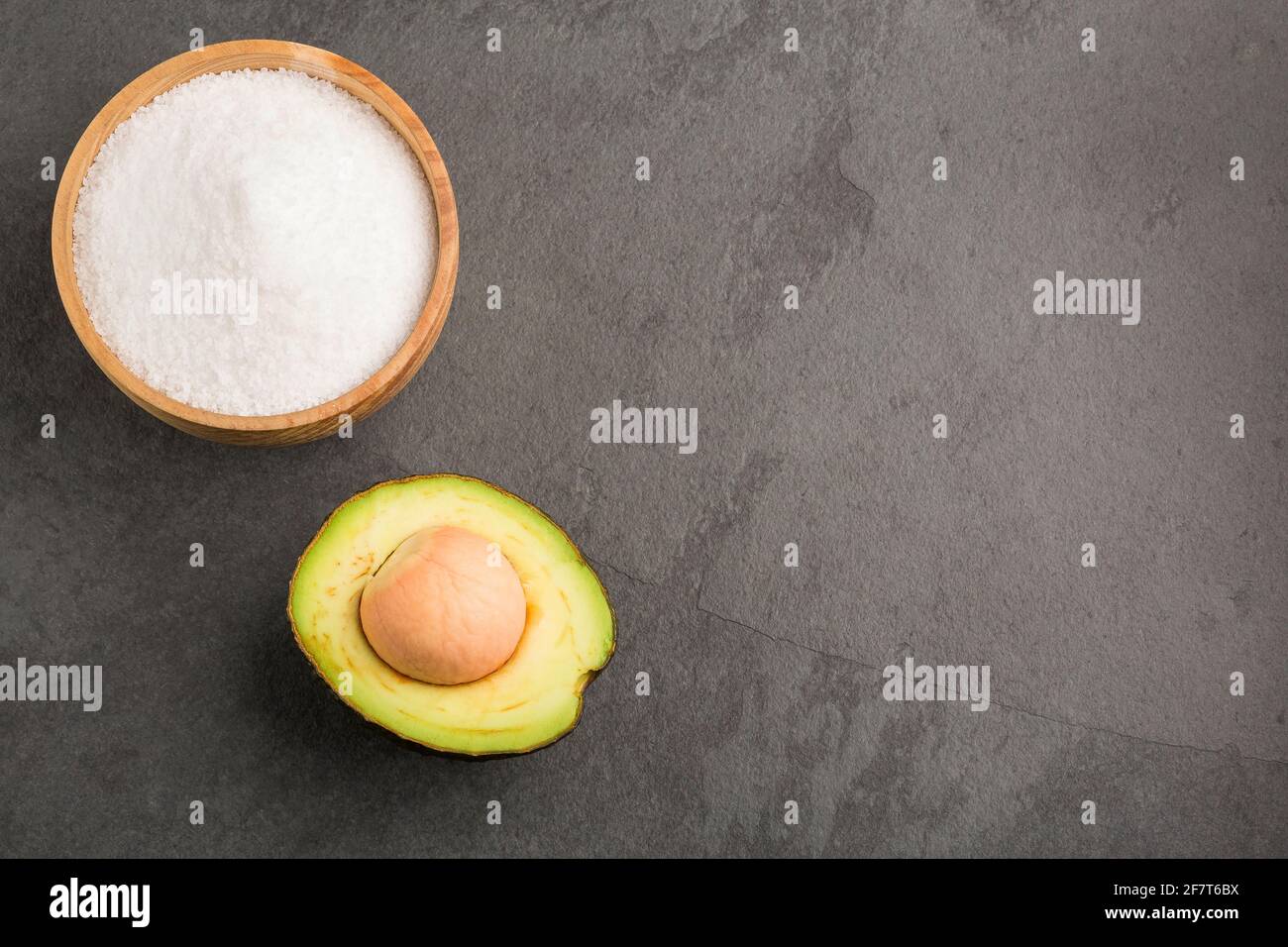 Avocado and salt - Persea americana 'Hass'. Top view Stock Photo - Alamy
