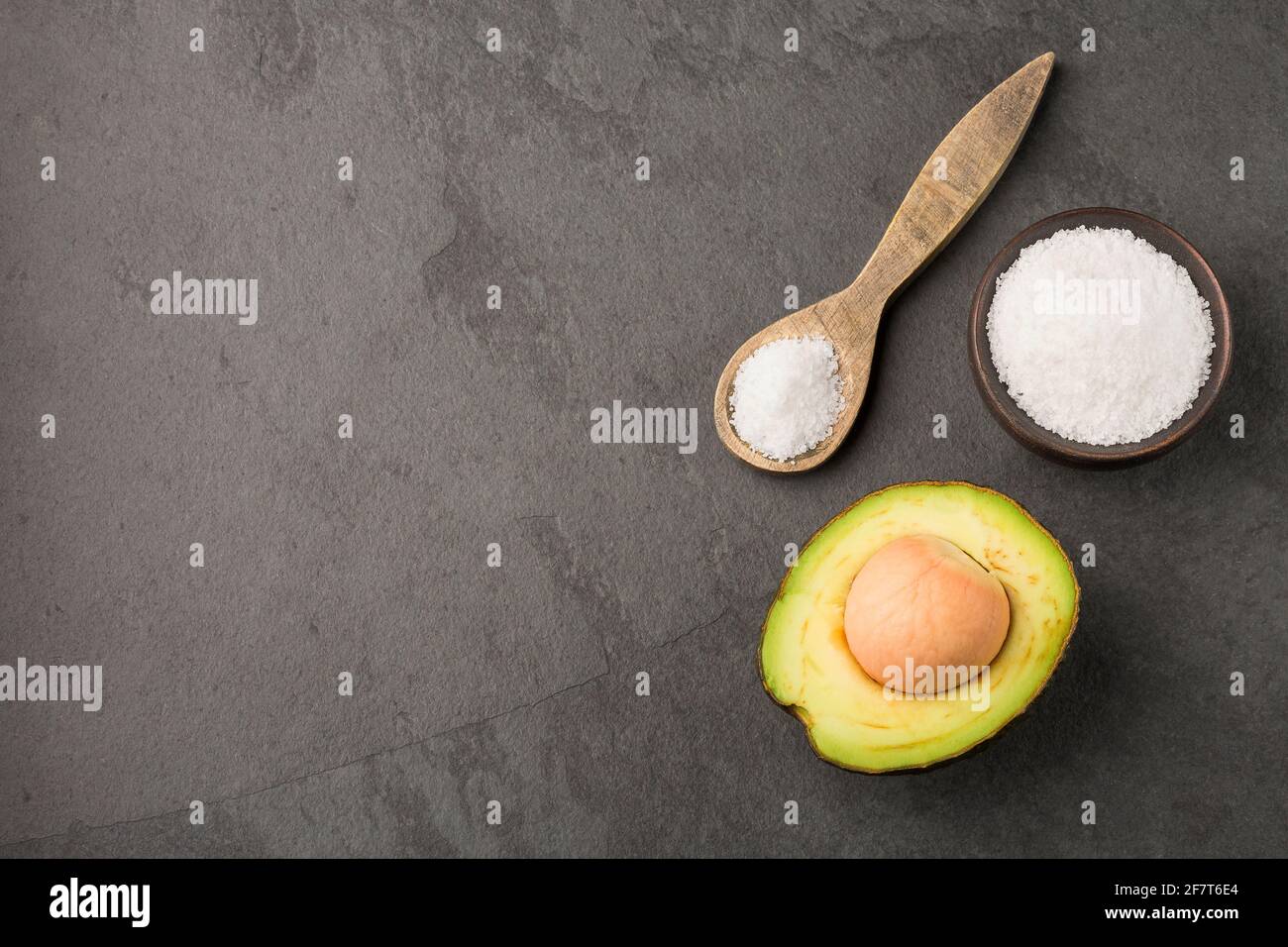 Avocado and salt - Persea americana 'Hass'. Top view Stock Photo - Alamy