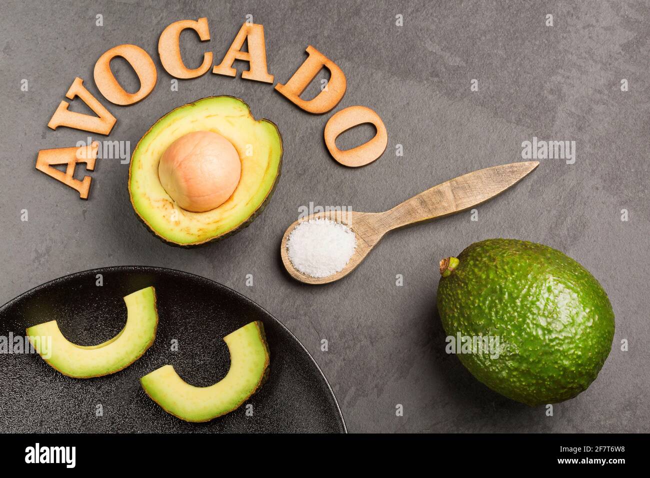 Avocado and salt - Persea americana 'Hass'. Top view Stock Photo - Alamy