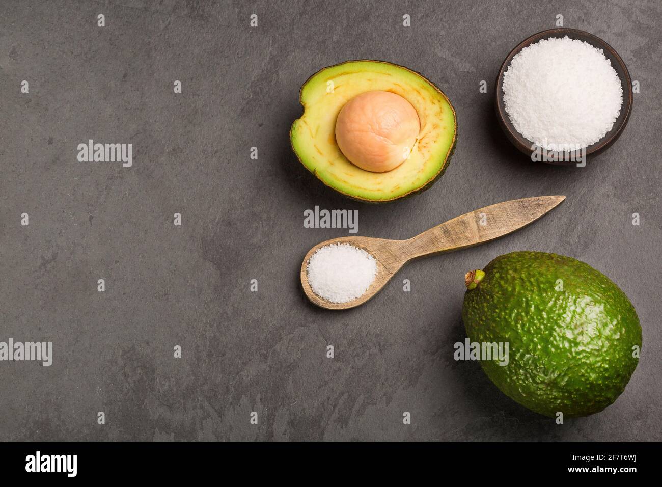 Avocado and salt - Persea americana 'Hass'. Top view Stock Photo - Alamy