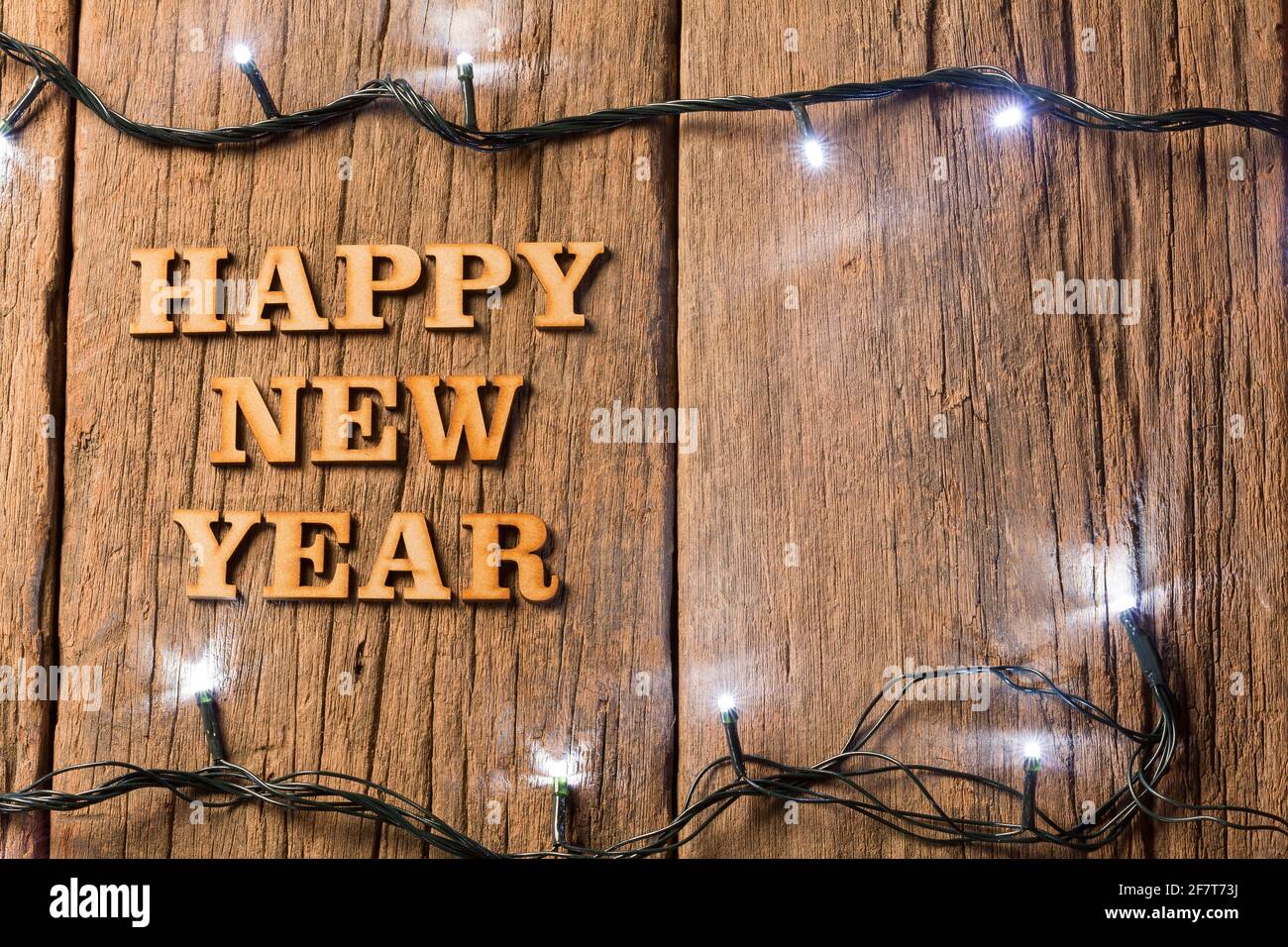 Happy New Year - Wooden background Stock Photo - Alamy