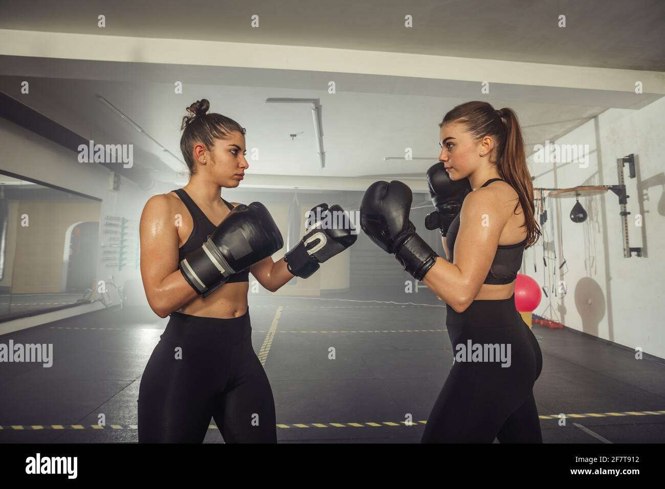 Female kickboxer doing a side kick Stock Photo - Alamy
