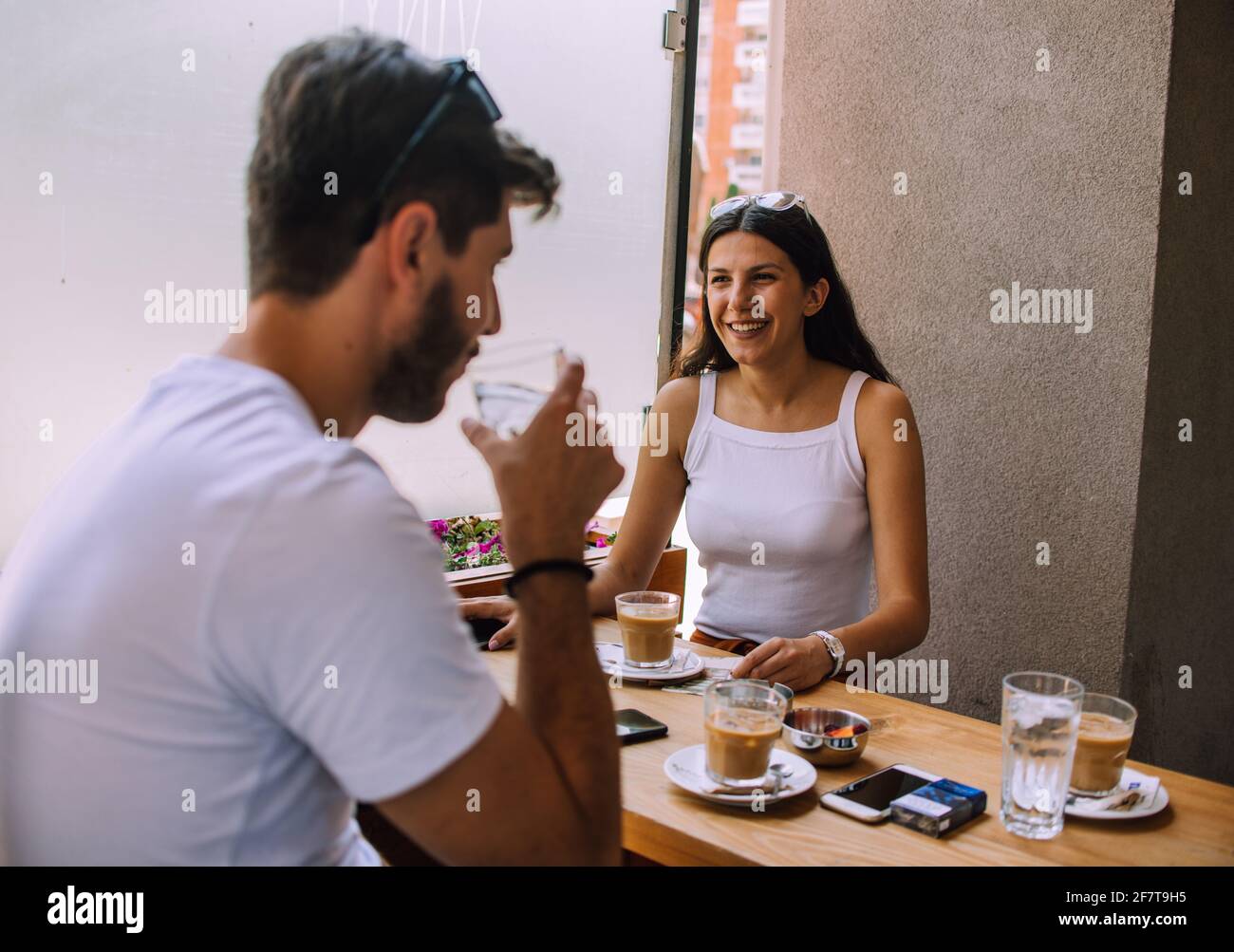 Woman making friend laugh hi-res stock photography and images - Alamy