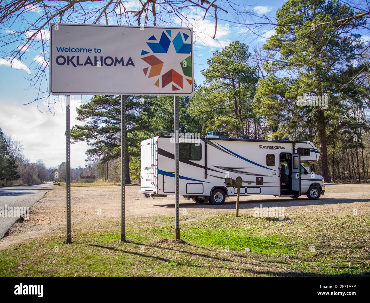 Road-sign welcomes those entering into Oklahoma with RV sitting in ...