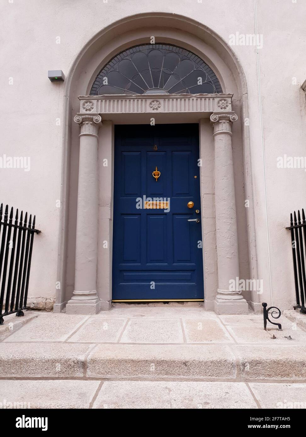 DUBLIN, IRELAND - Jul 24, 2019: A navy blue arched front door of ...