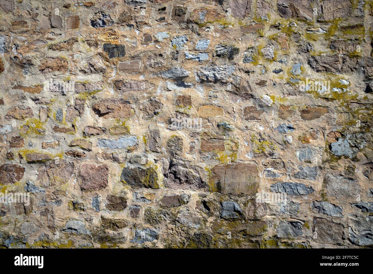 17th century old rock stone wall background texture Stock Photo - Alamy