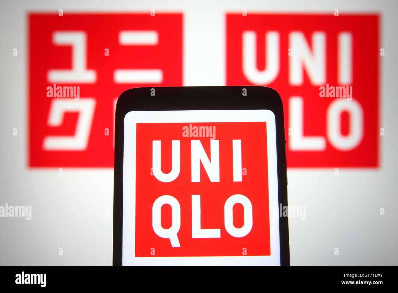 In this photo illustration an Uniqlo logo of a Japanese retail company ...