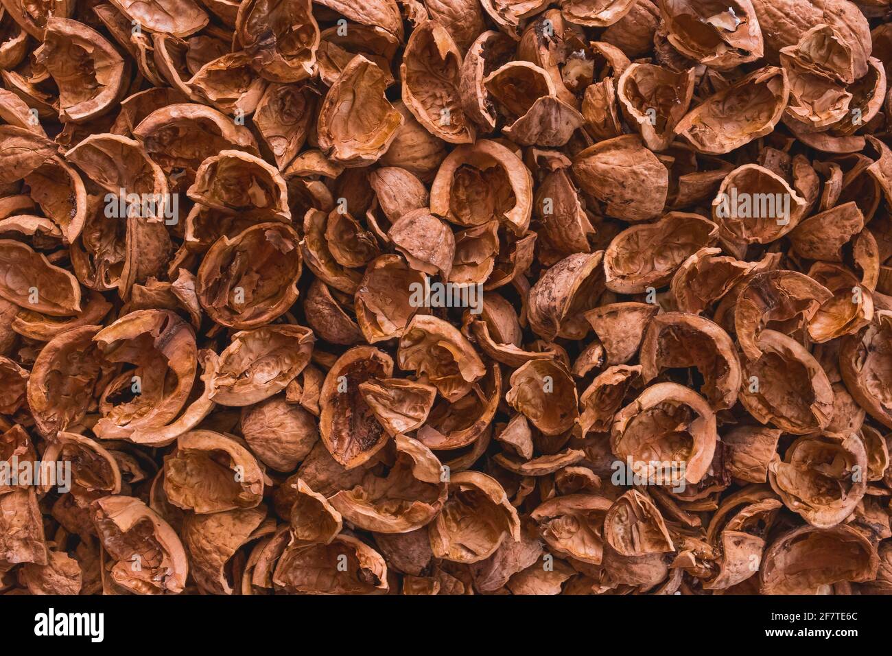 Walnut shell brown background, peeled walnut texture Stock Photo - Alamy