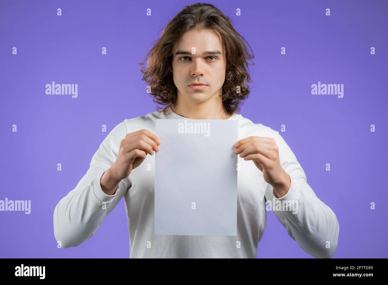 Person holding a4 paper hi-res stock photography and images - Alamy