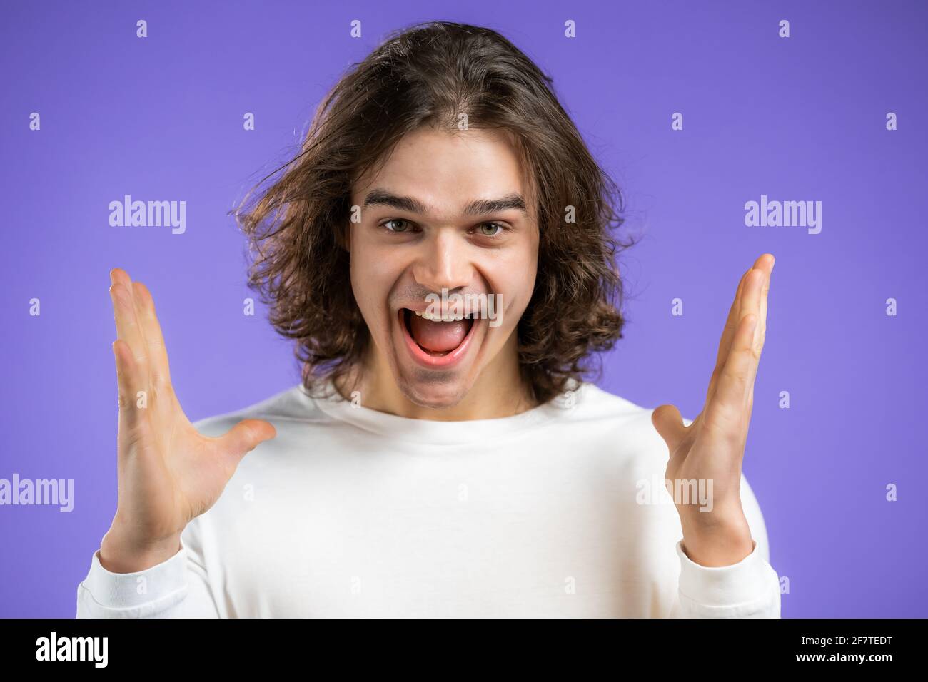 Man depicts amazement, shows WOW delight face effect. Surprised excited ...