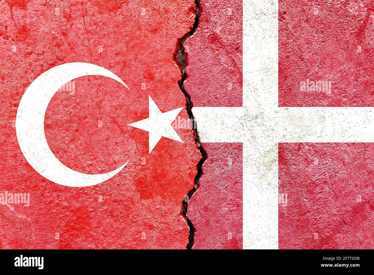 Flags of Turkey and Denmark isolated on cracked wall background Stock ...