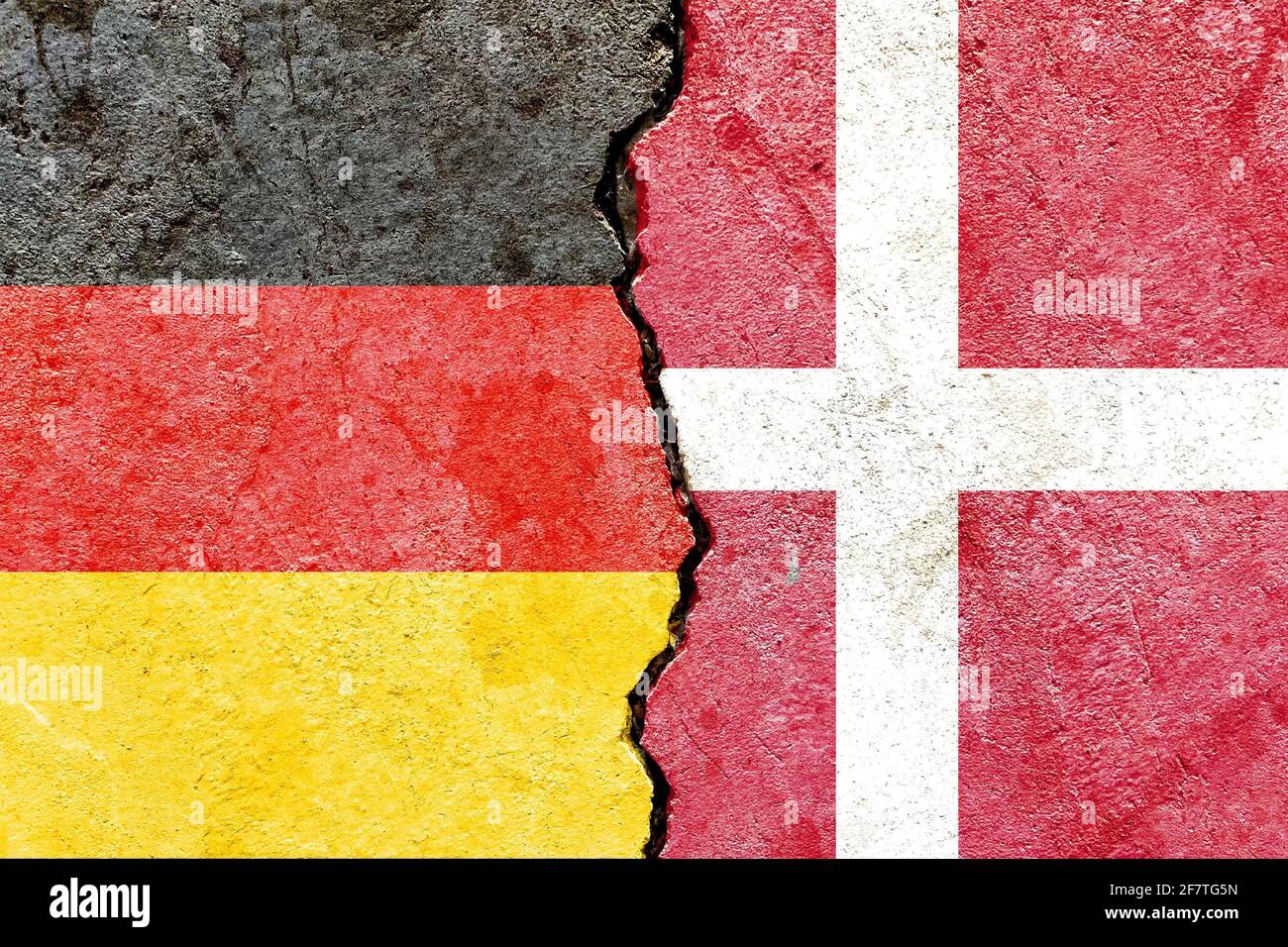 Flags of Germany and Denmark isolated on cracked wall background Stock ...