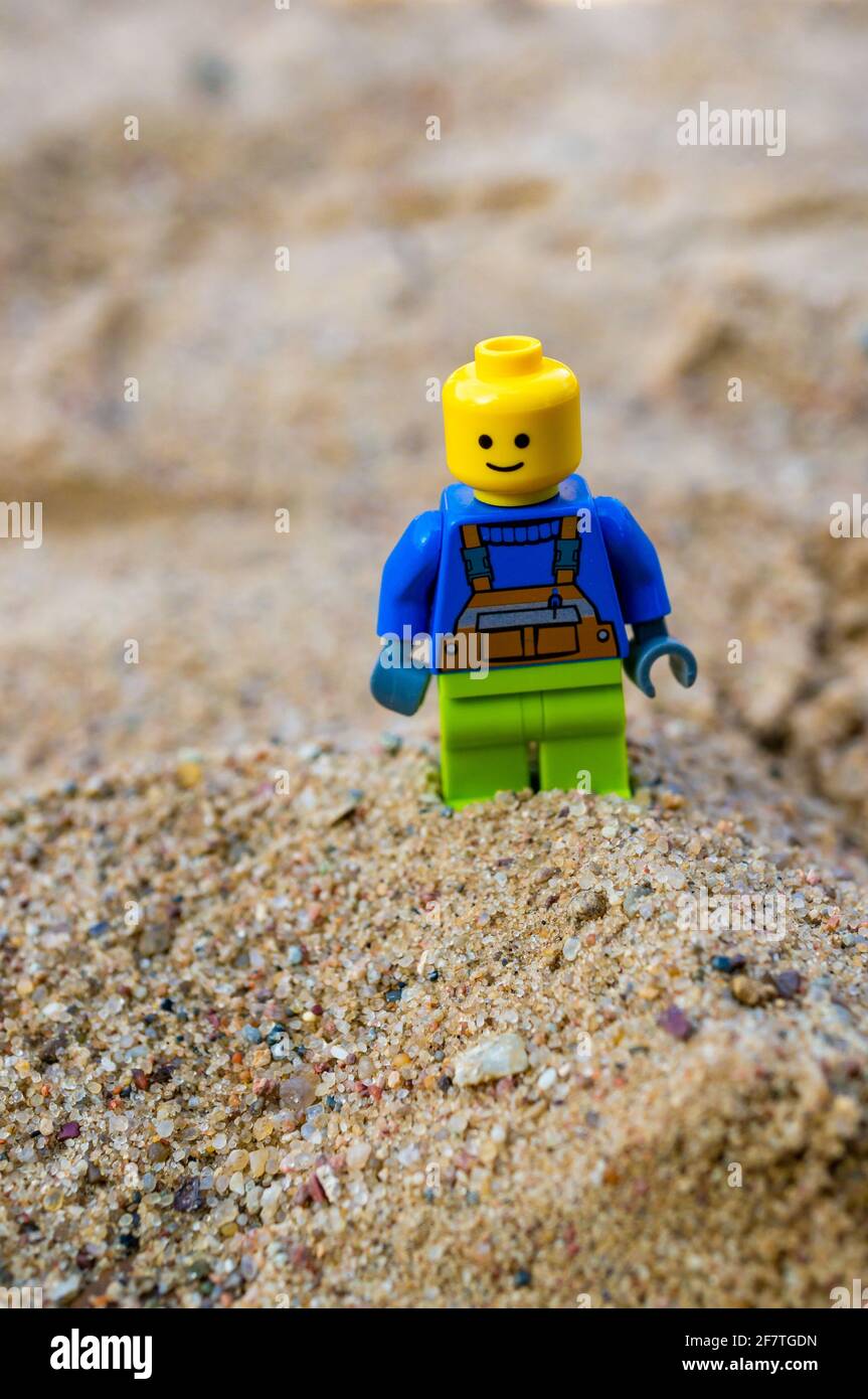 POZNAN, POLAND - Mar 30, 2021: Lego man figurine standing on sand ...