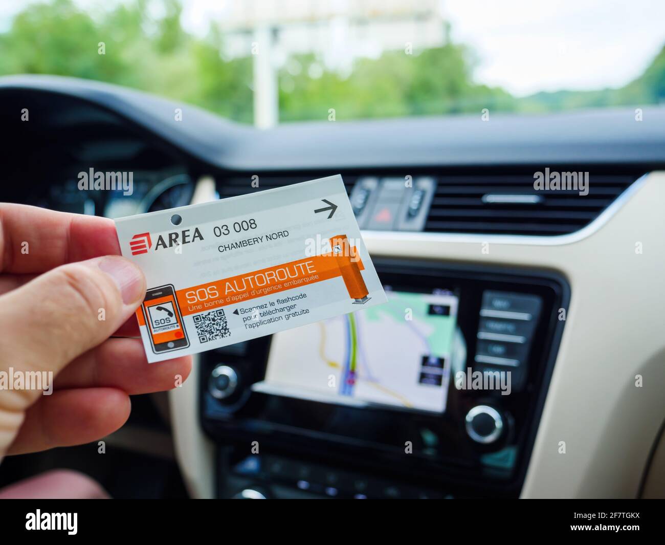 Driver male hand holding inside car ticket of Toll Road operated by ...