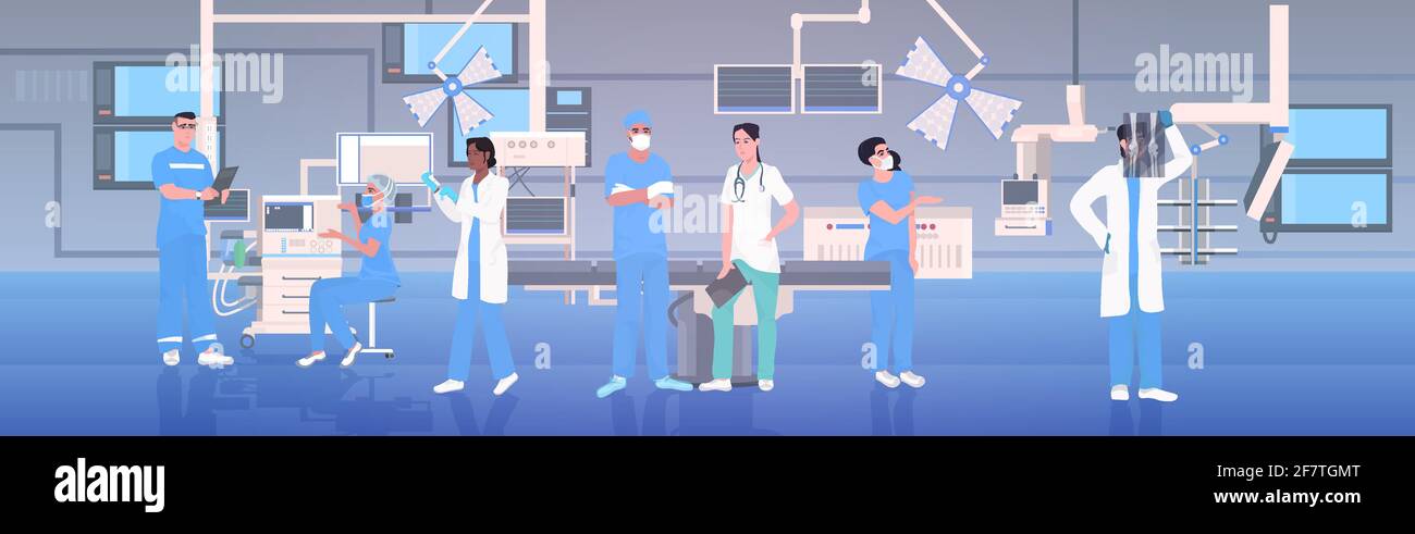 medical doctors team in uniform working together in operating room ...