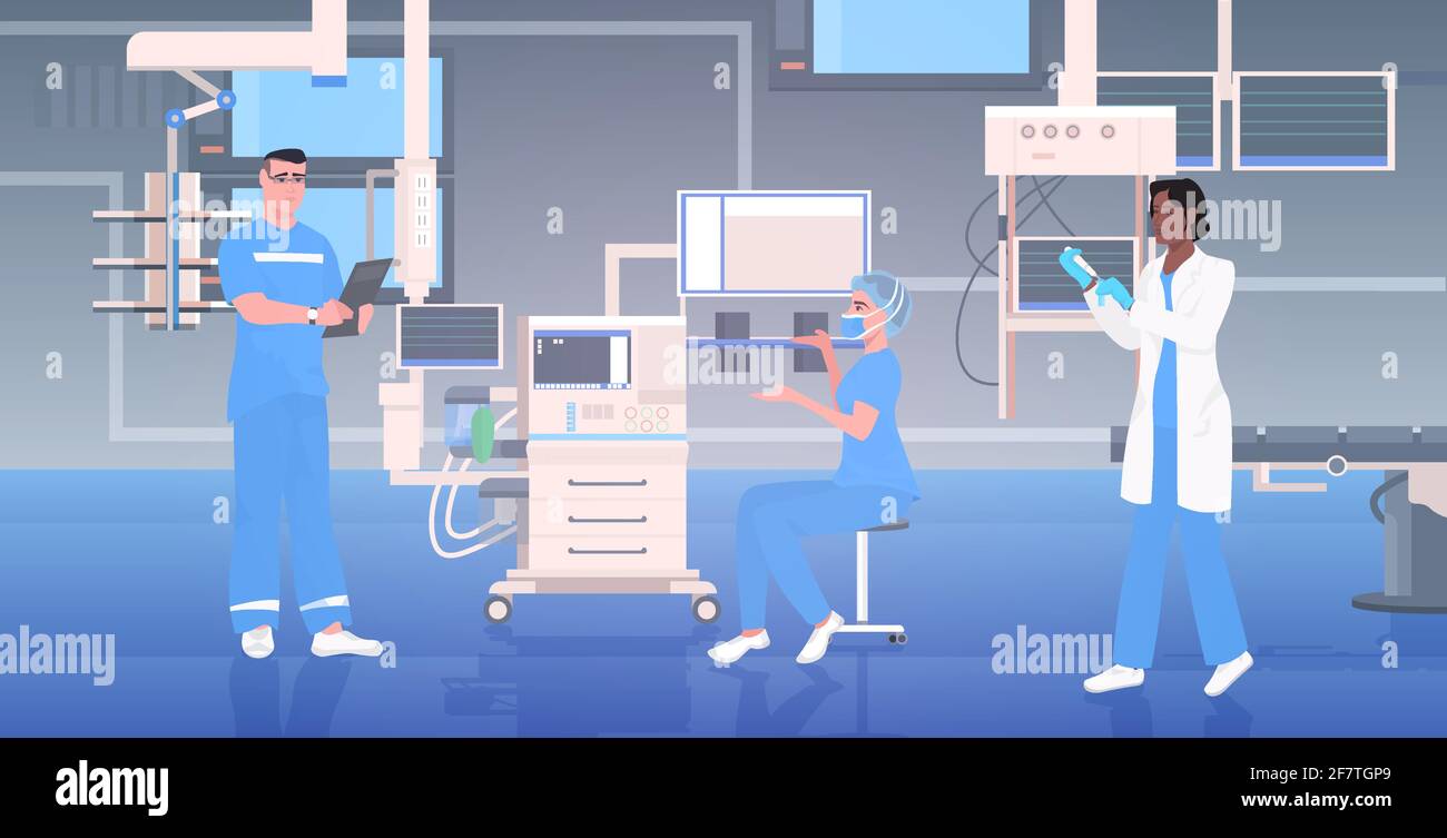 medical doctors team in uniform working together in operating room ...