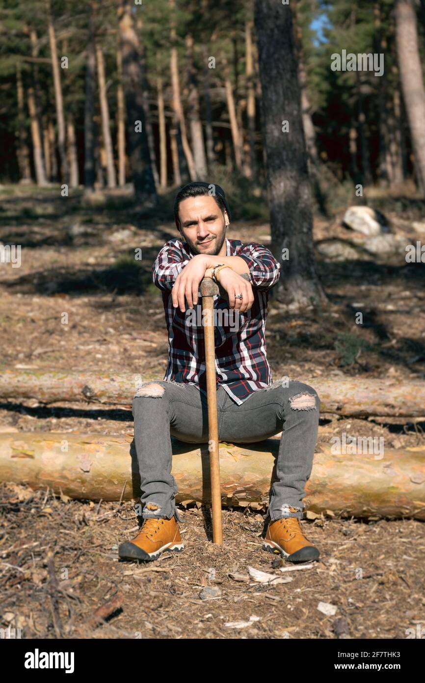 Muscular man sitting on wooden hi-res stock photography and images - Alamy