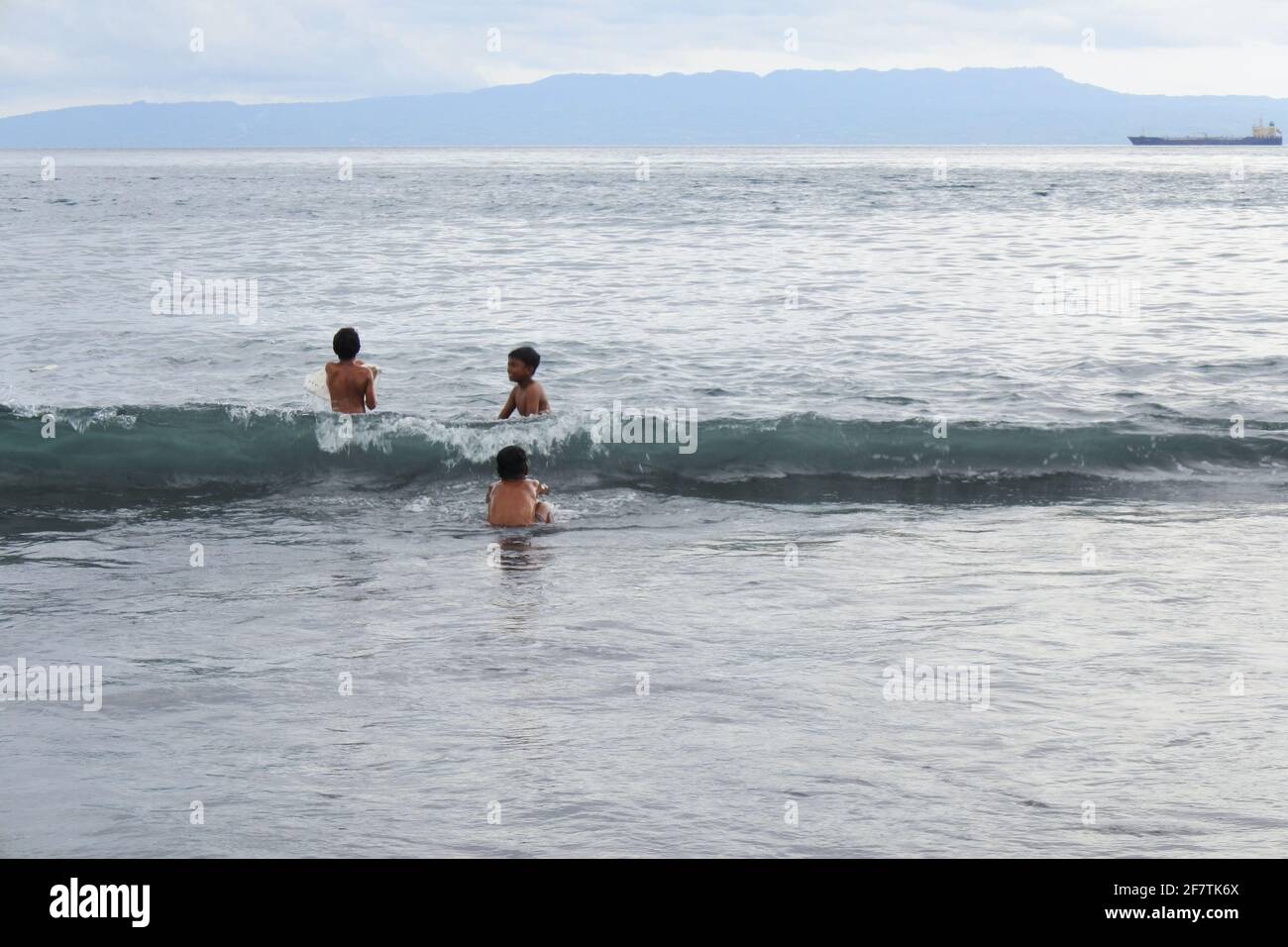 DENPASAR, INDONESIA - Jan 15, 2021: children playing on the beach in ...