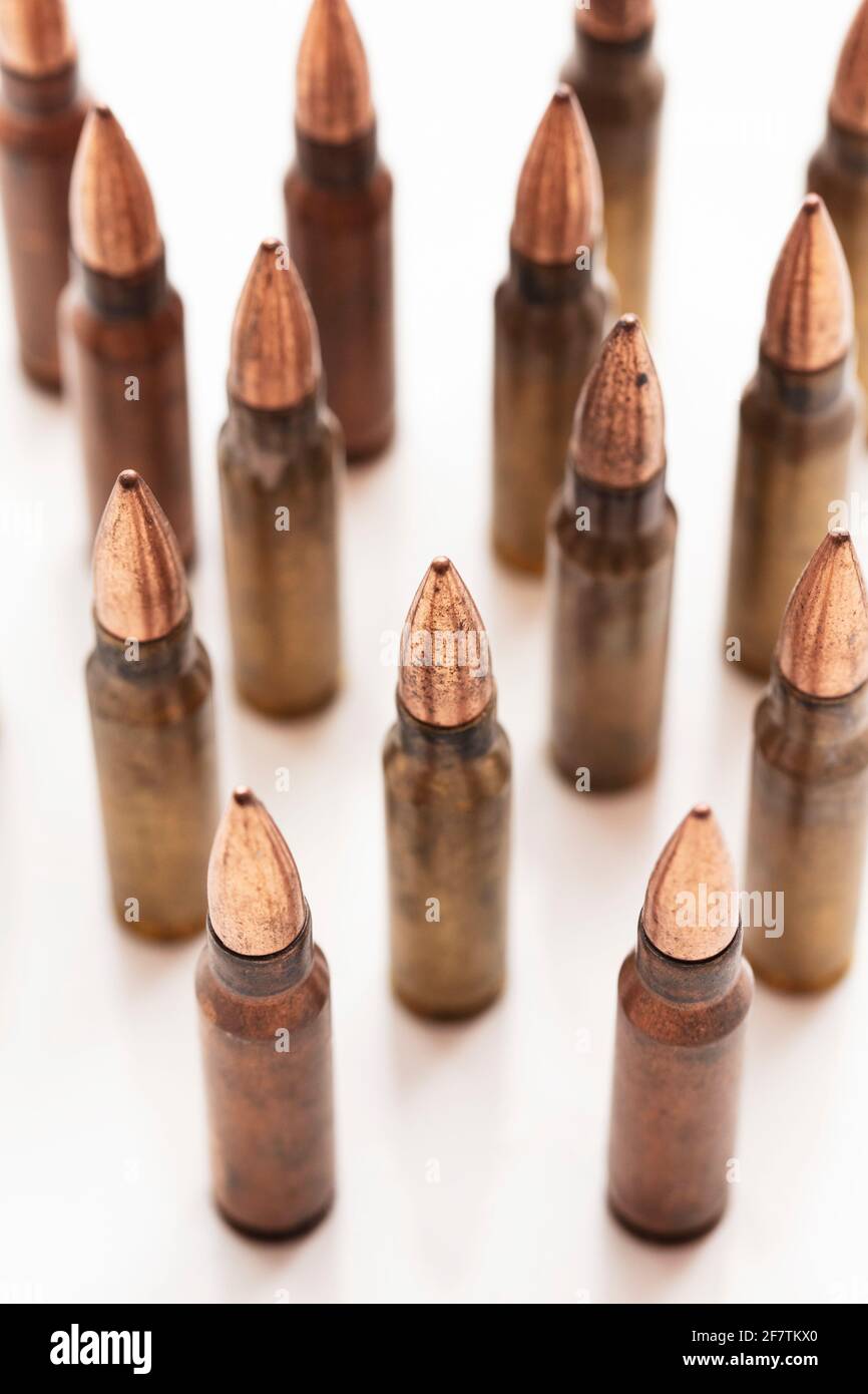 A group of bullet ammunition shells on a white background Stock Photo ...