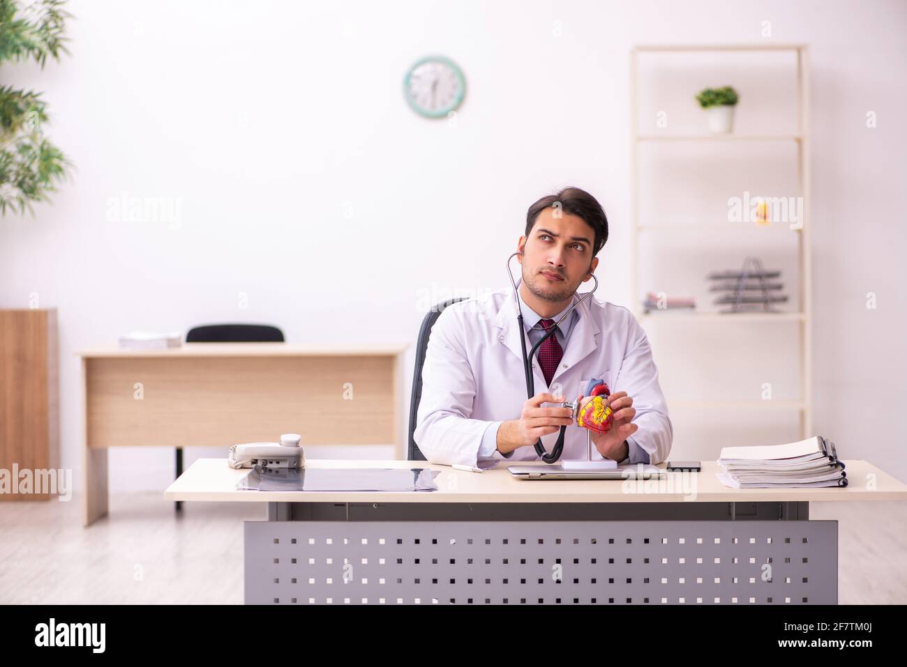 Young male doctor cardiologist working at the hospital Stock Photo - Alamy
