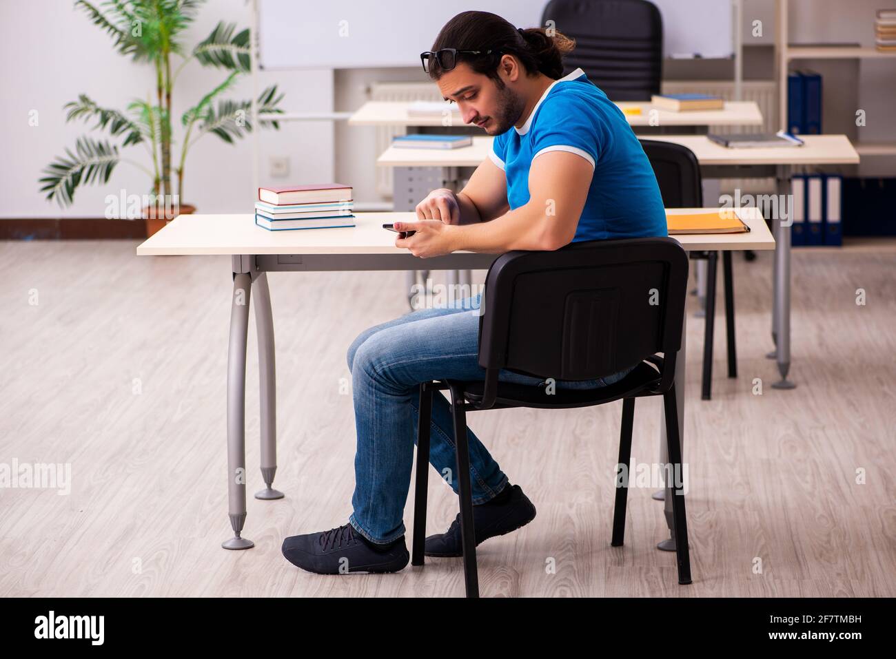 High school student texting in class hi-res stock photography and ...
