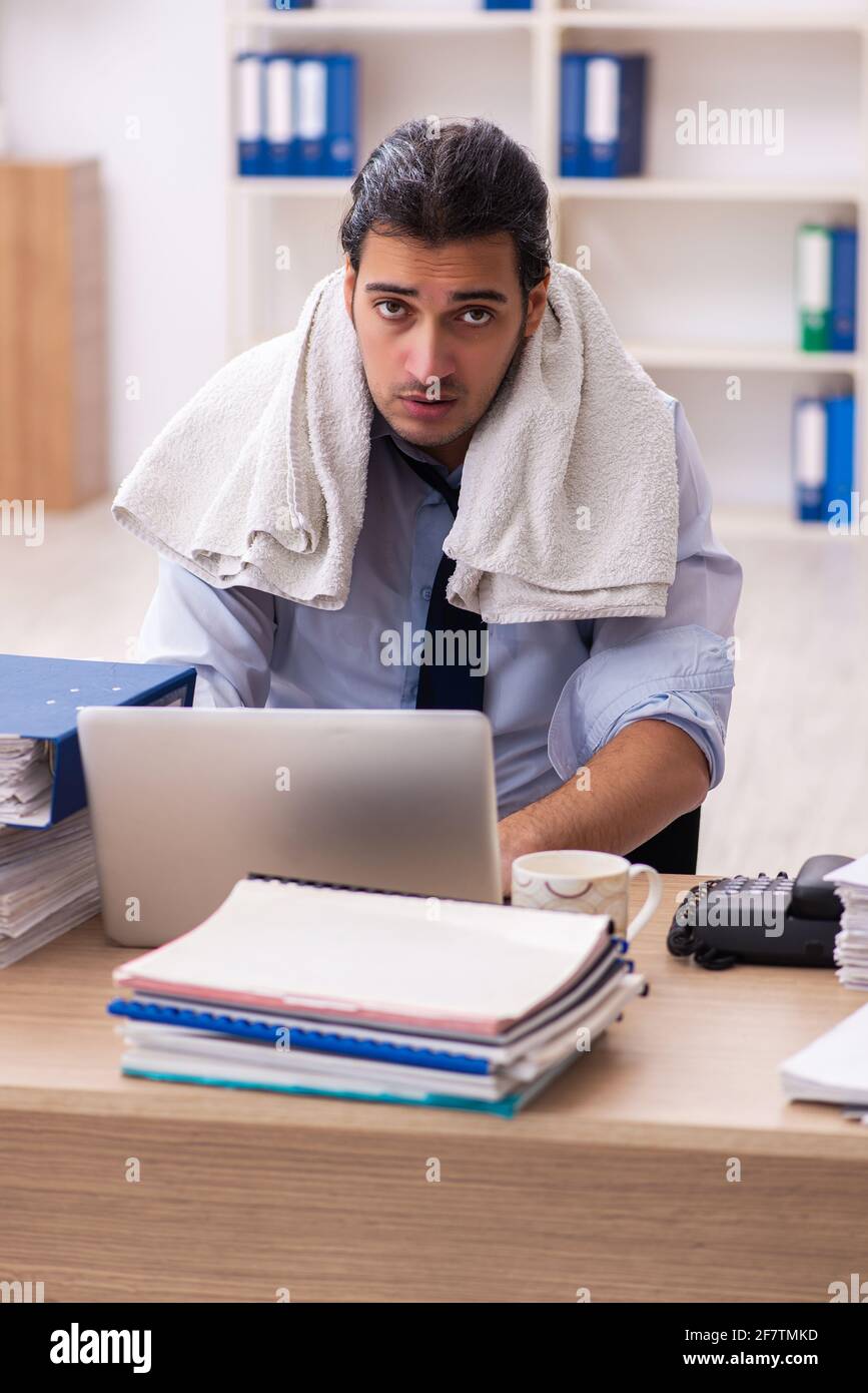 Young businessman employee sweating in the office Stock Photo - Alamy
