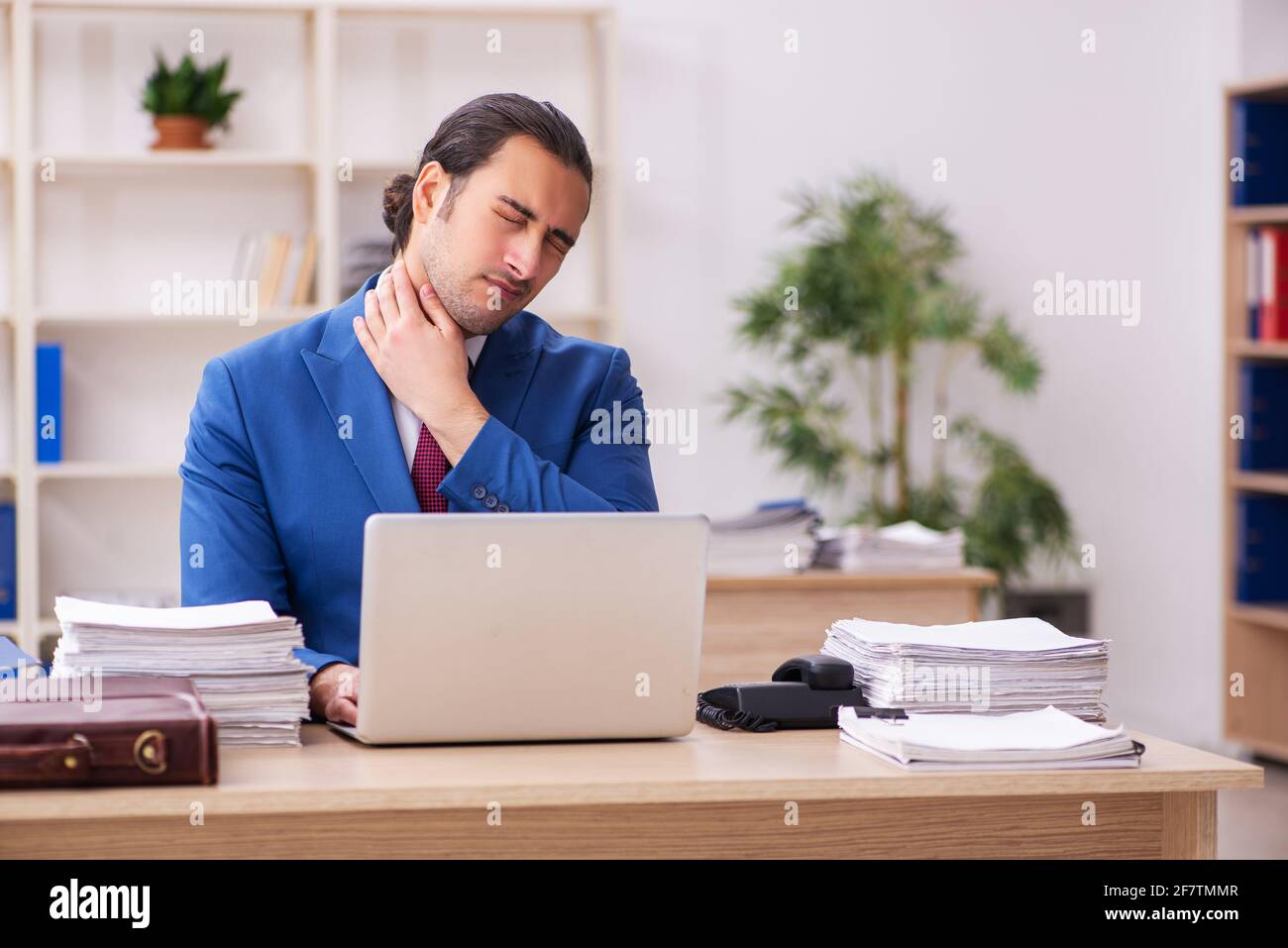 Extremely tired businessman male employee in the office Stock Photo - Alamy