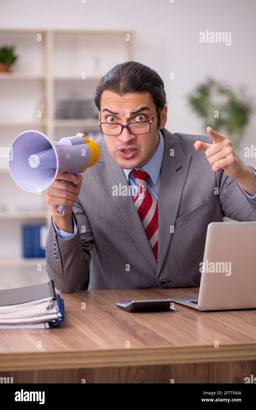 Young businessman megaphone showing hi-res stock photography and images ...