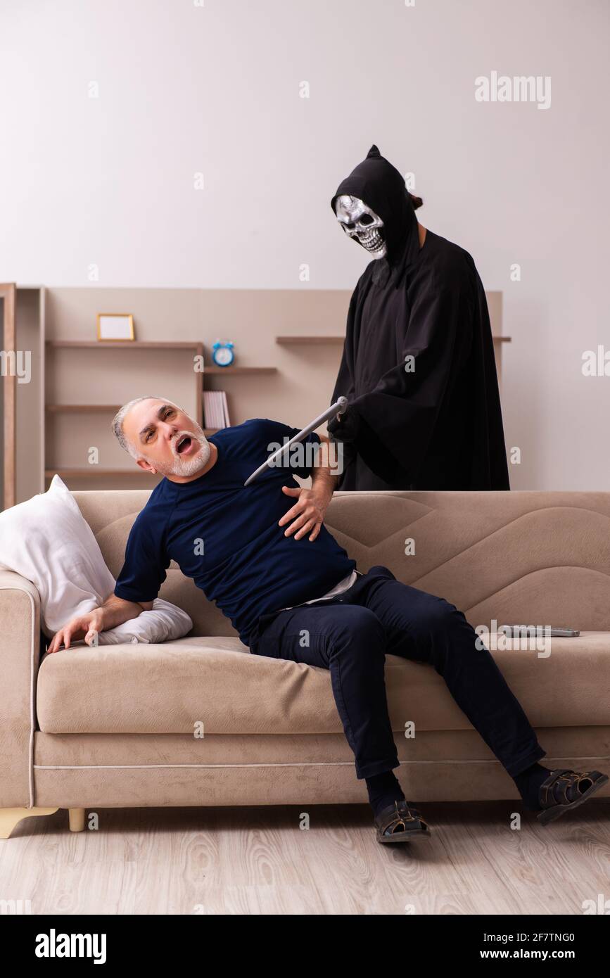 Devil coming to old dying man Stock Photo - Alamy