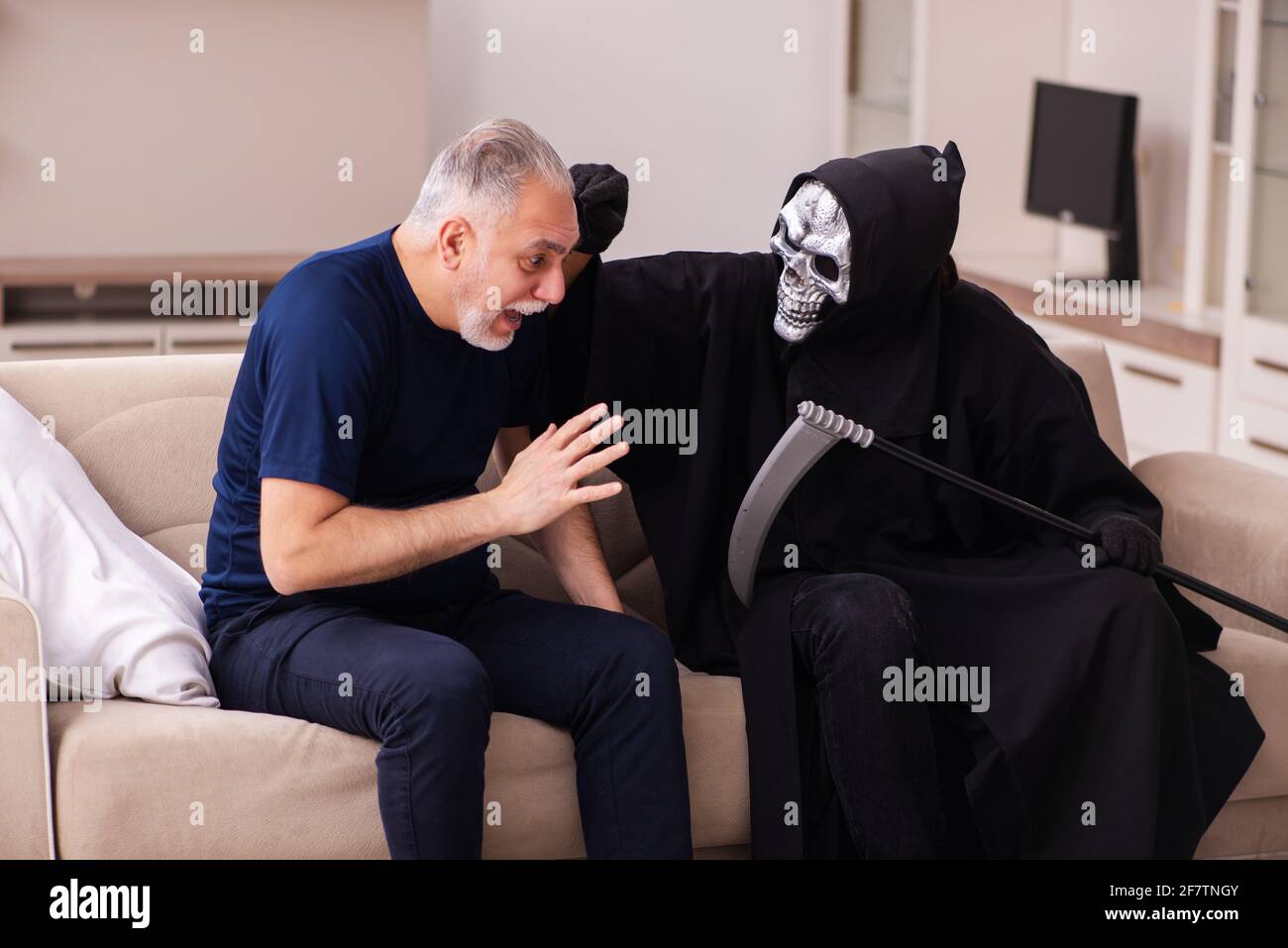 Devil coming to old dying man Stock Photo - Alamy