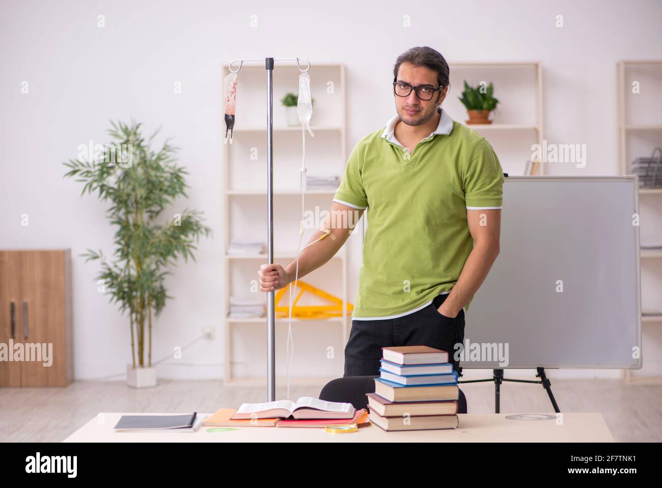 Young sick teacher student in blood transfusion concept Stock Photo - Alamy