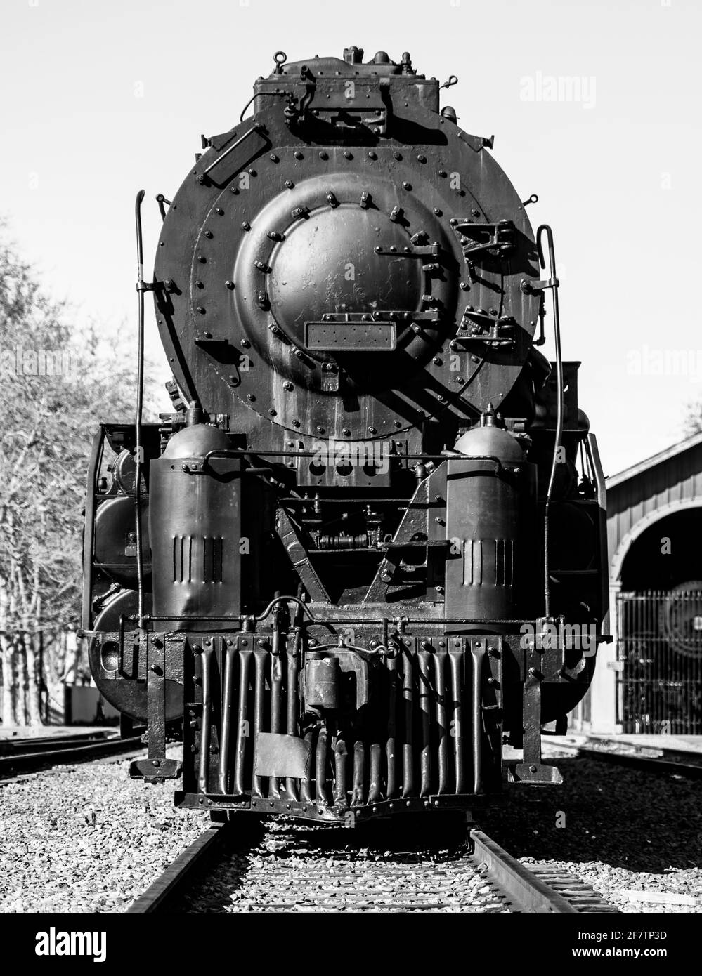Vertical grayscale shot of an old steam locomotive Stock Photo - Alamy