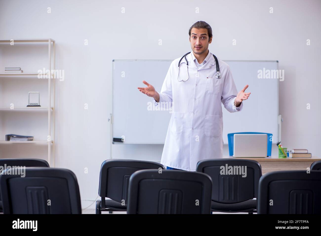 Young doctor giving seminar in the classroom Stock Photo - Alamy