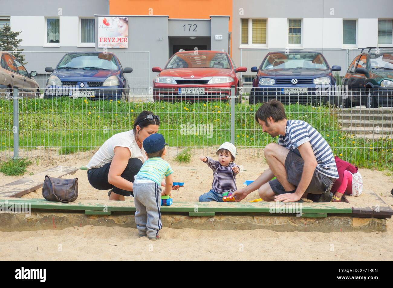 POZNAN, POLAND - May 10, 2016: Man, woman and two boys playing on a ...